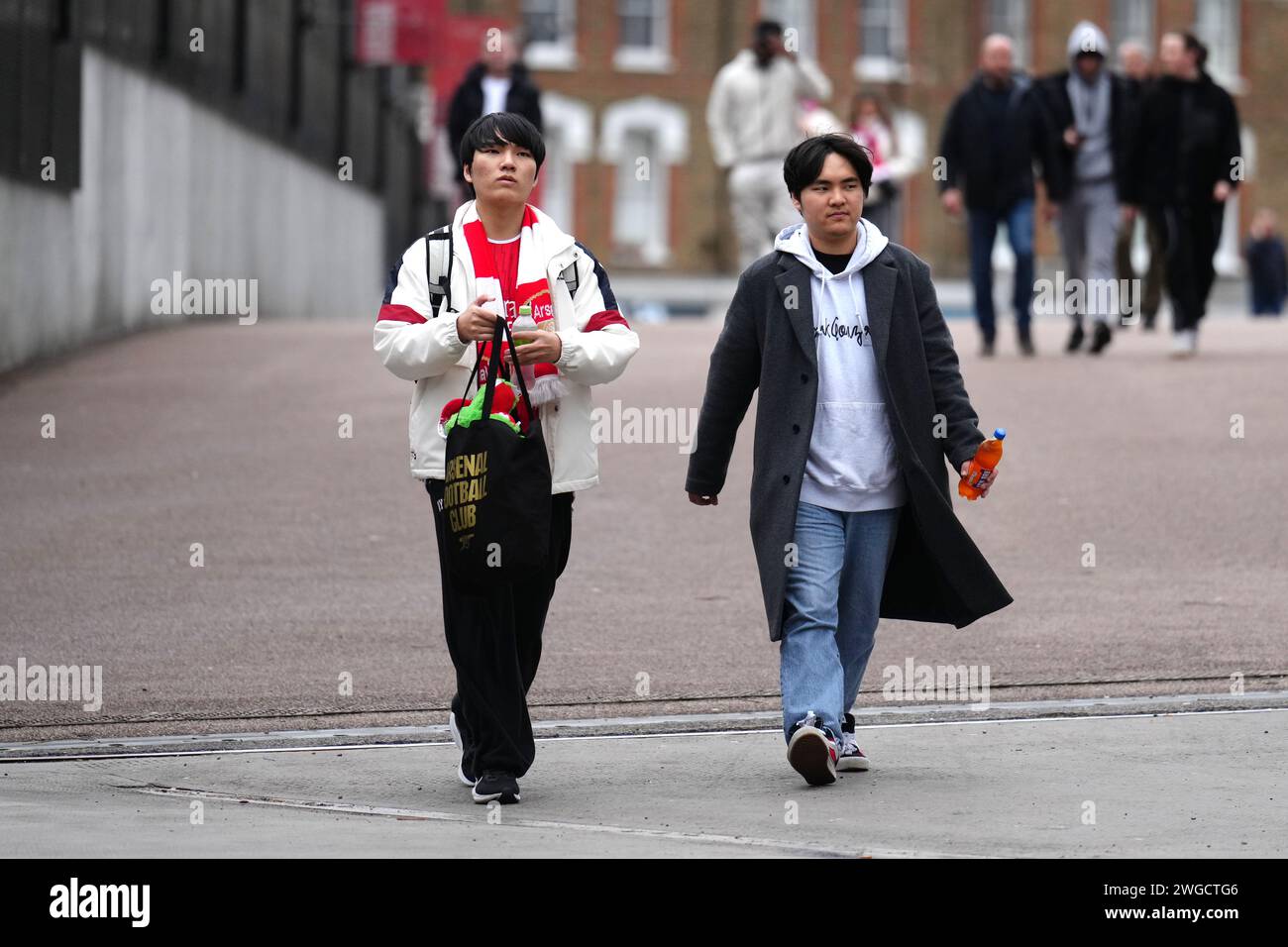 Arsenal fans make their way to the stadium ahead of the Premier League ...