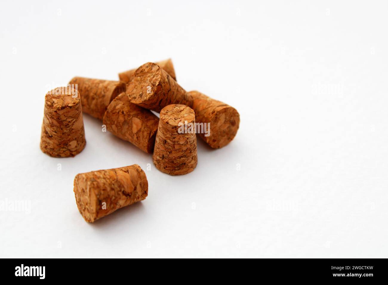 Various messy corks on white background Stock Photo - Alamy