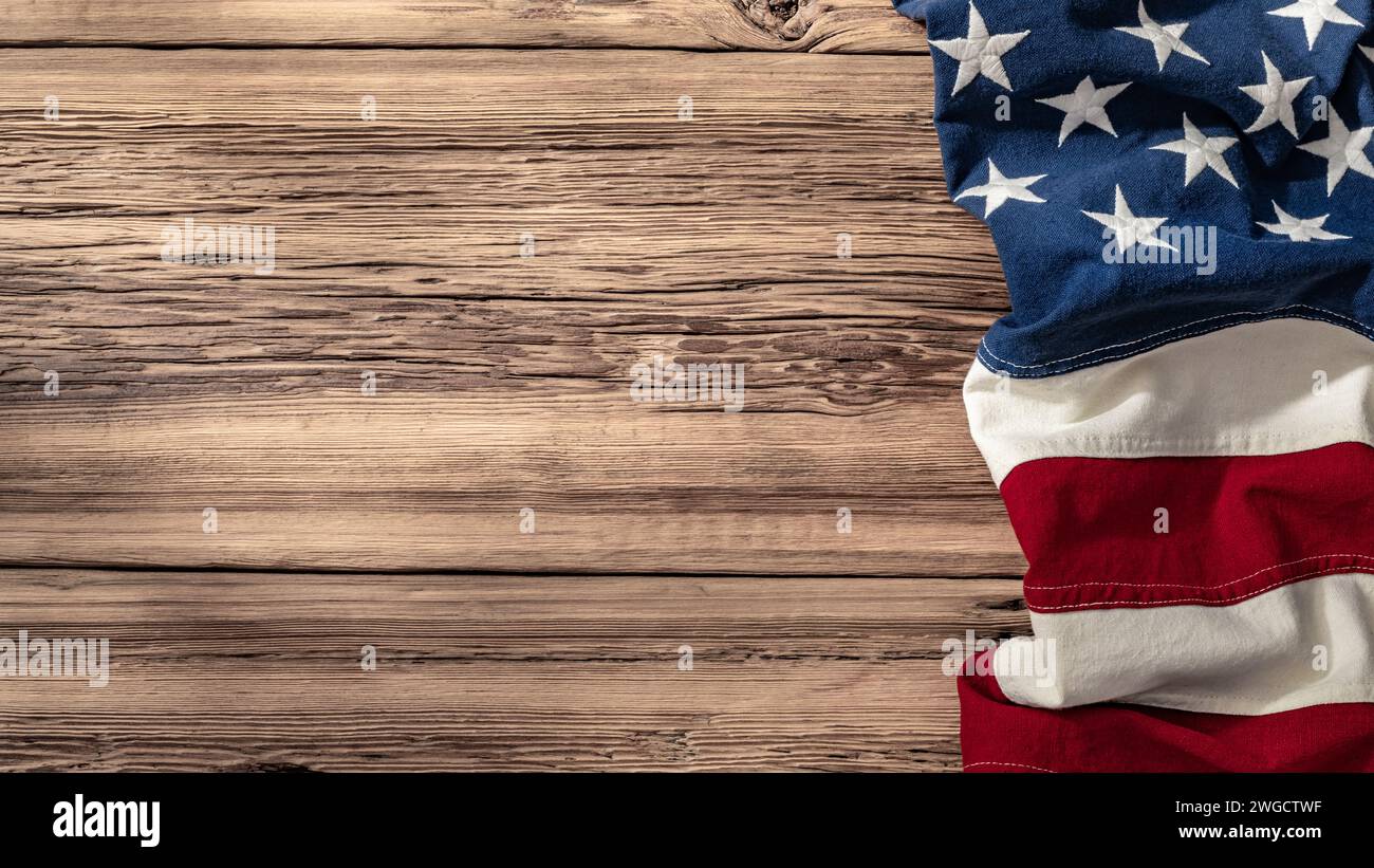 American Flag Draped Over a Rustic Wooden Surface Symbolizing ...
