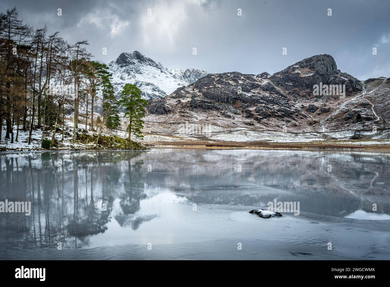 Reflections in a frozen Blea Tarn Stock Photo - Alamy