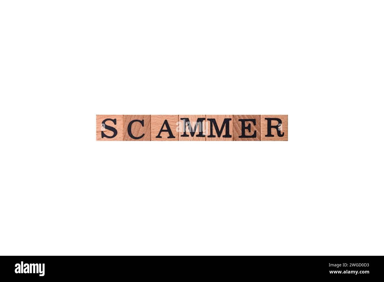 The inscription Scammer made of wooden cubes on a plain background. Can ...