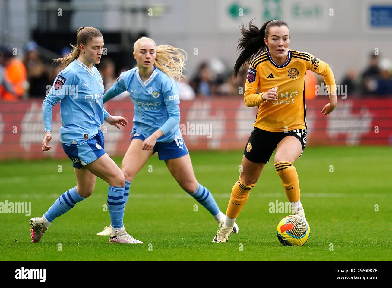 Leicester City's Missy Goodwin (right) goes past Manchester City's Jess ...