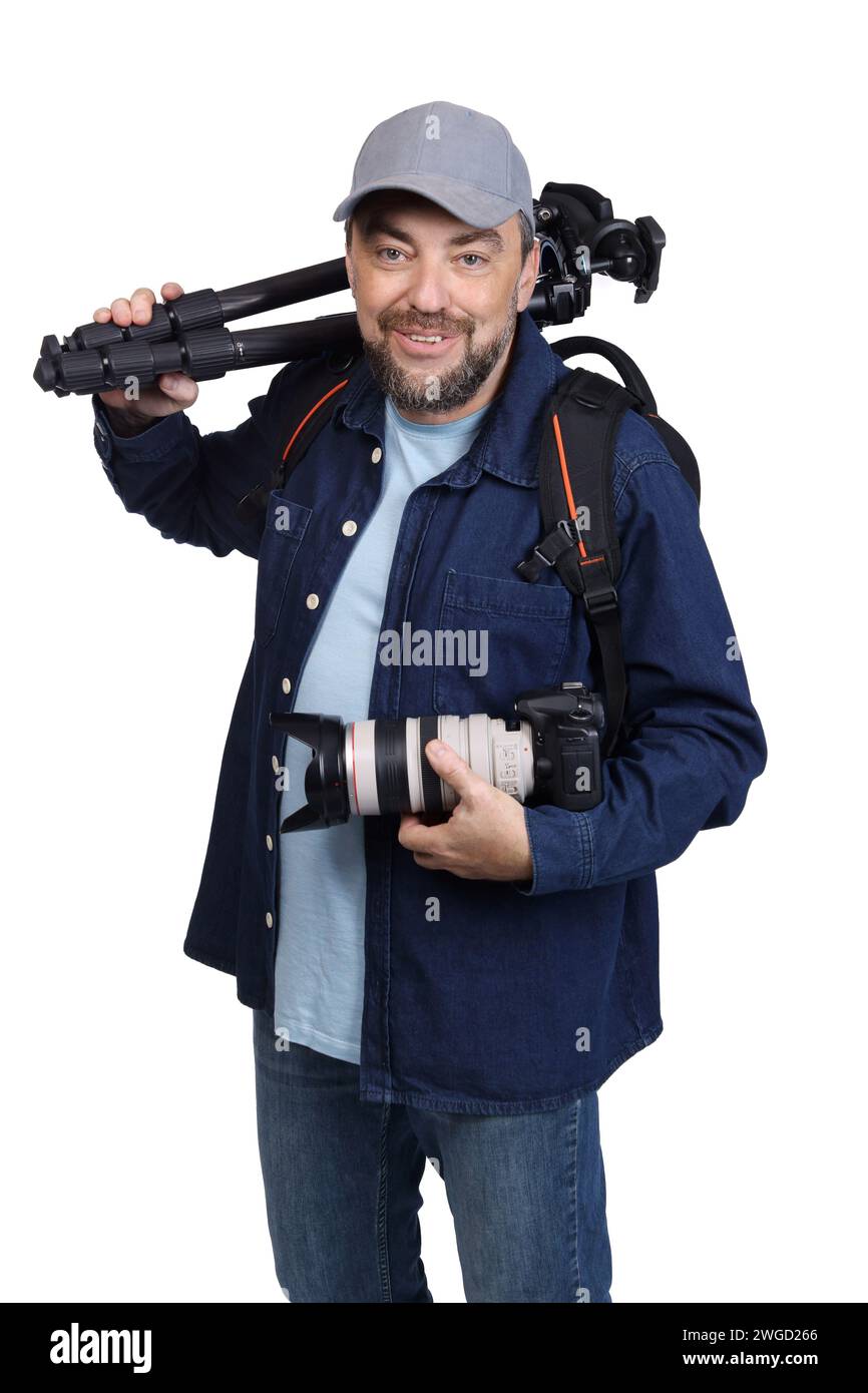 Male photographer posing with modern digital SLR camera and tripod ...