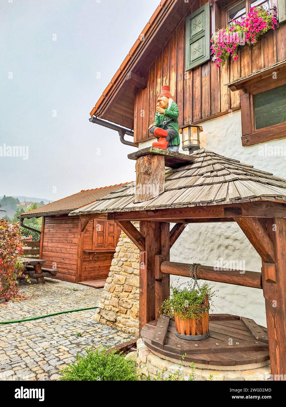 Baba Yaga. Fairy-tale wooden houses with Windows and flowers. Czech ...