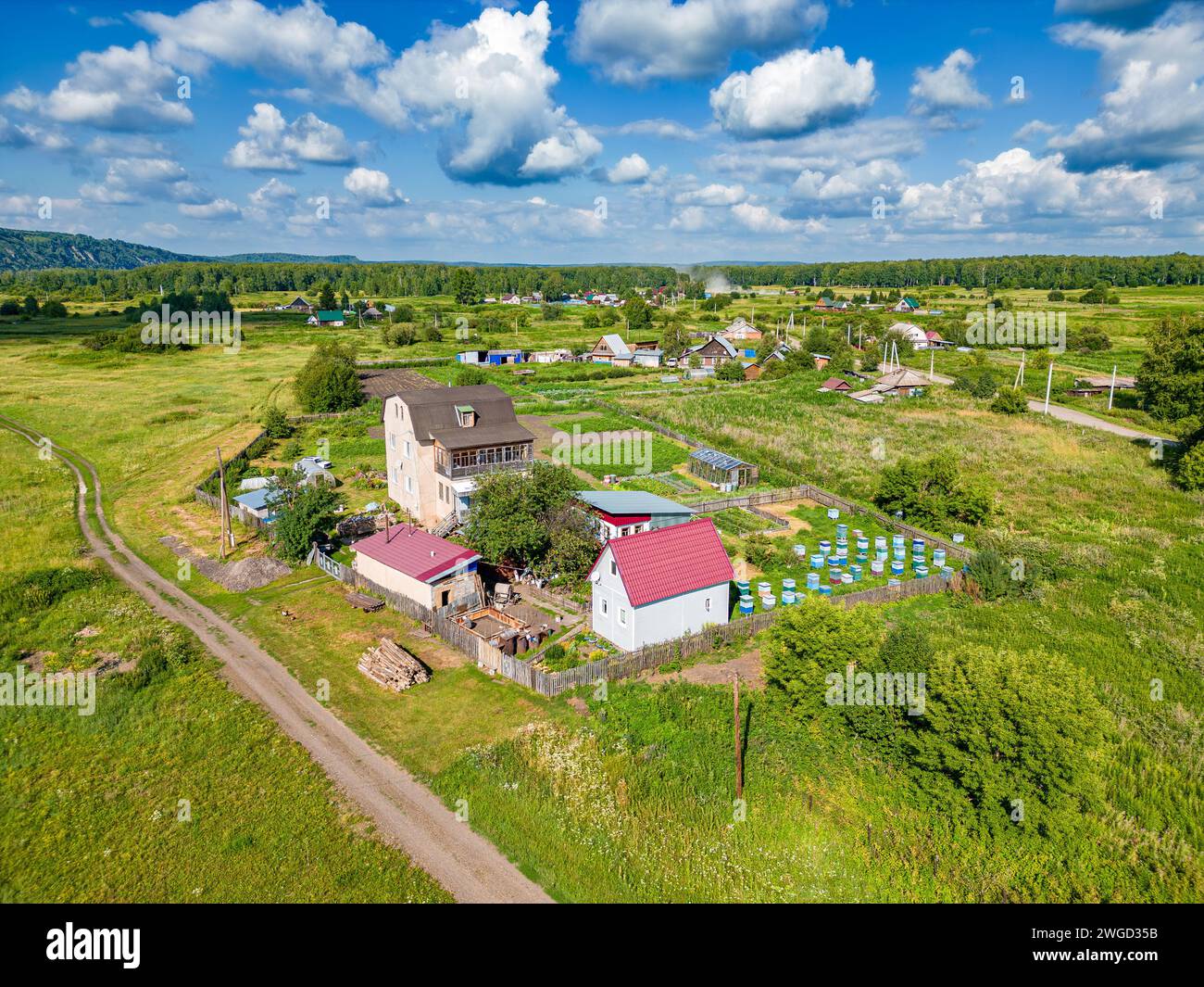 Rural scene with courtyard and trees hi-res stock photography and ...
