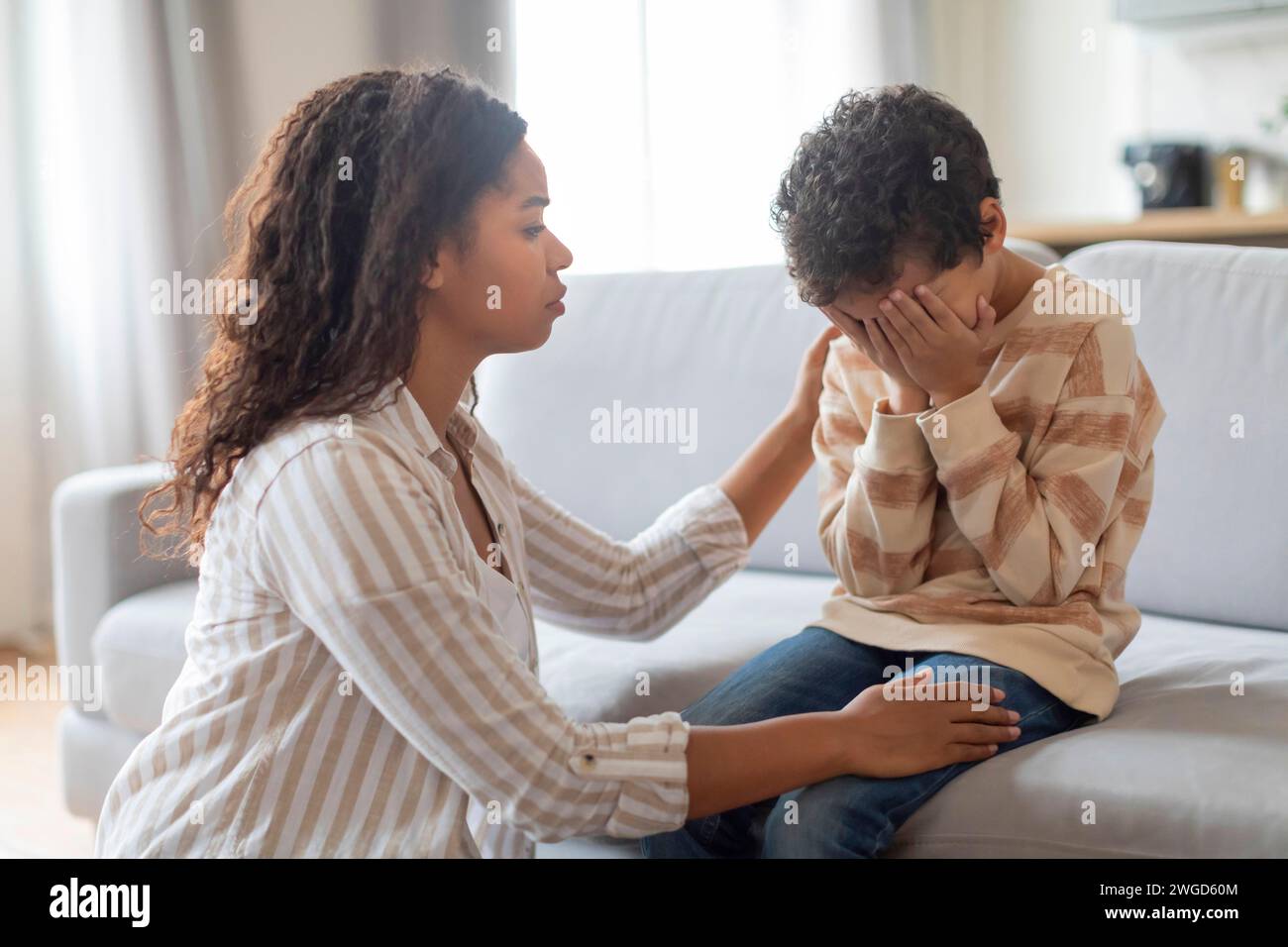 Kid comforting consoling upset sad boy hi-res stock photography and ...