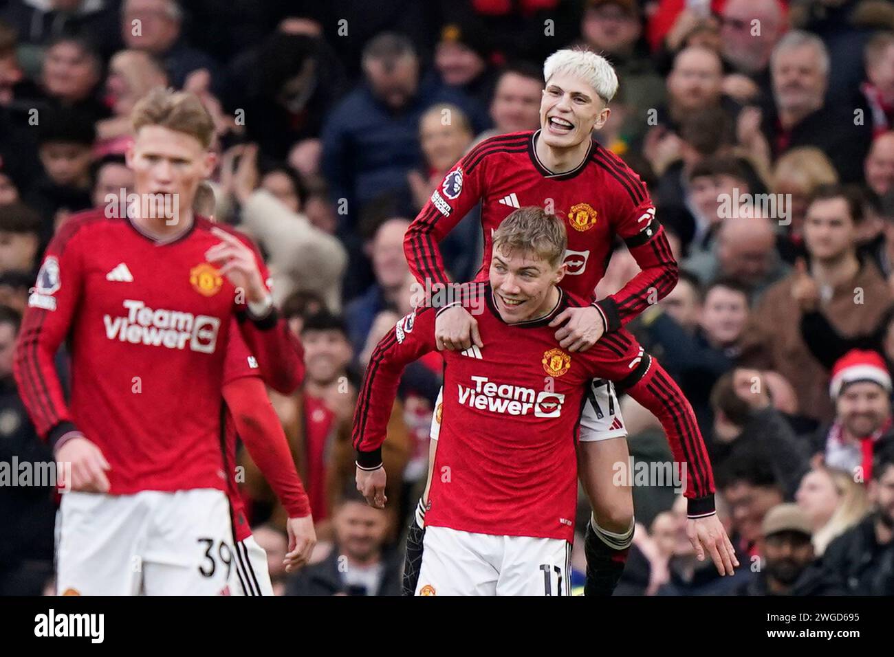 Manchester United's Alejandro Garnacho jumps on Rasmus Hojlund's back ...
