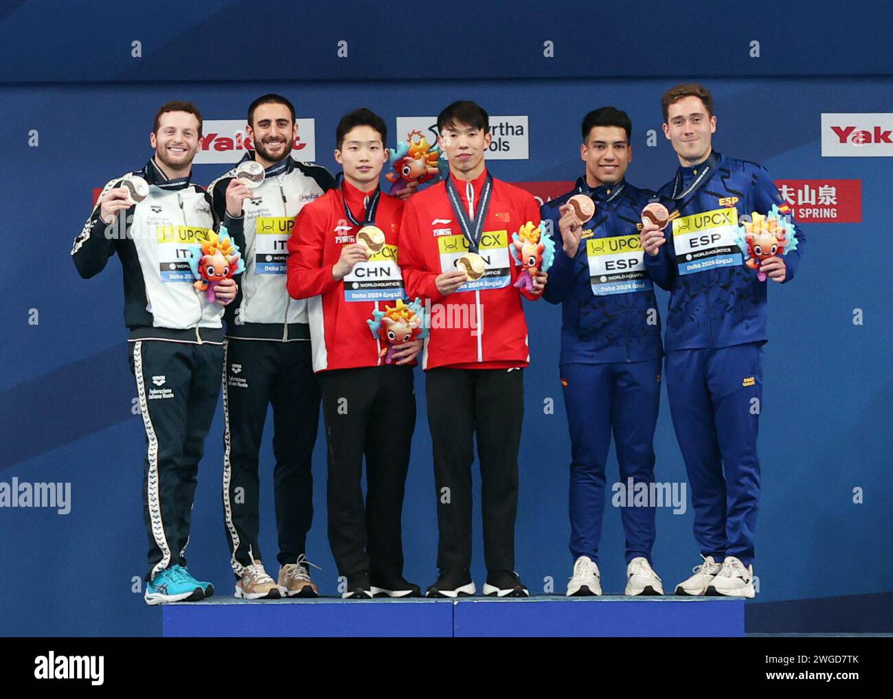 Doha, Qatar. 4th Feb, 2024. Gold medalists China's Wang Zongyuan (3rd L)/Long Daoyi (3rd R ...