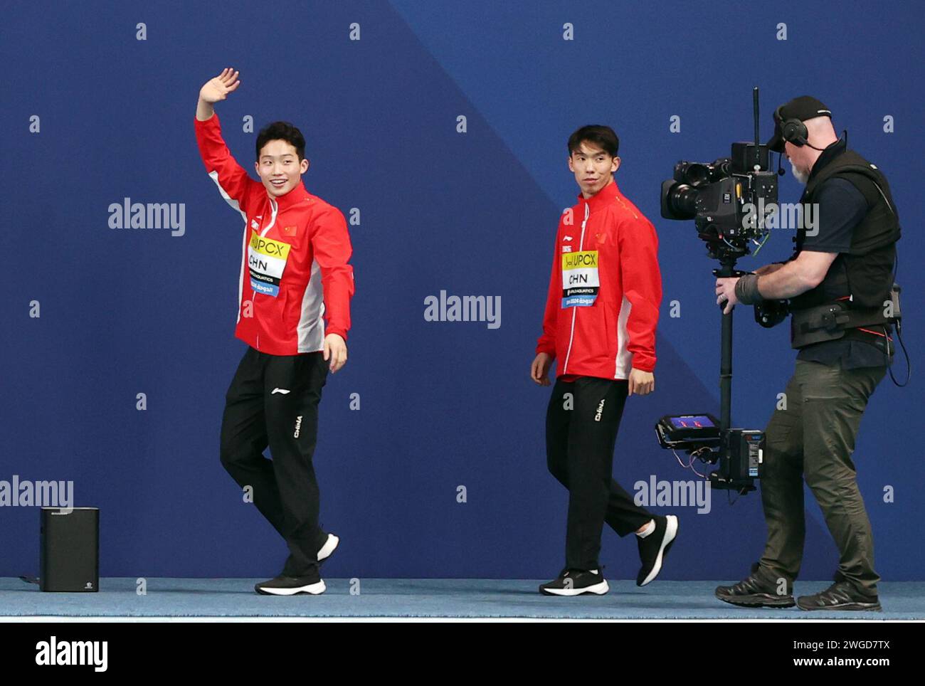 Doha, Qatar. 4th Feb, 2024. Gold medalists China's Wang Zongyuan (L ...