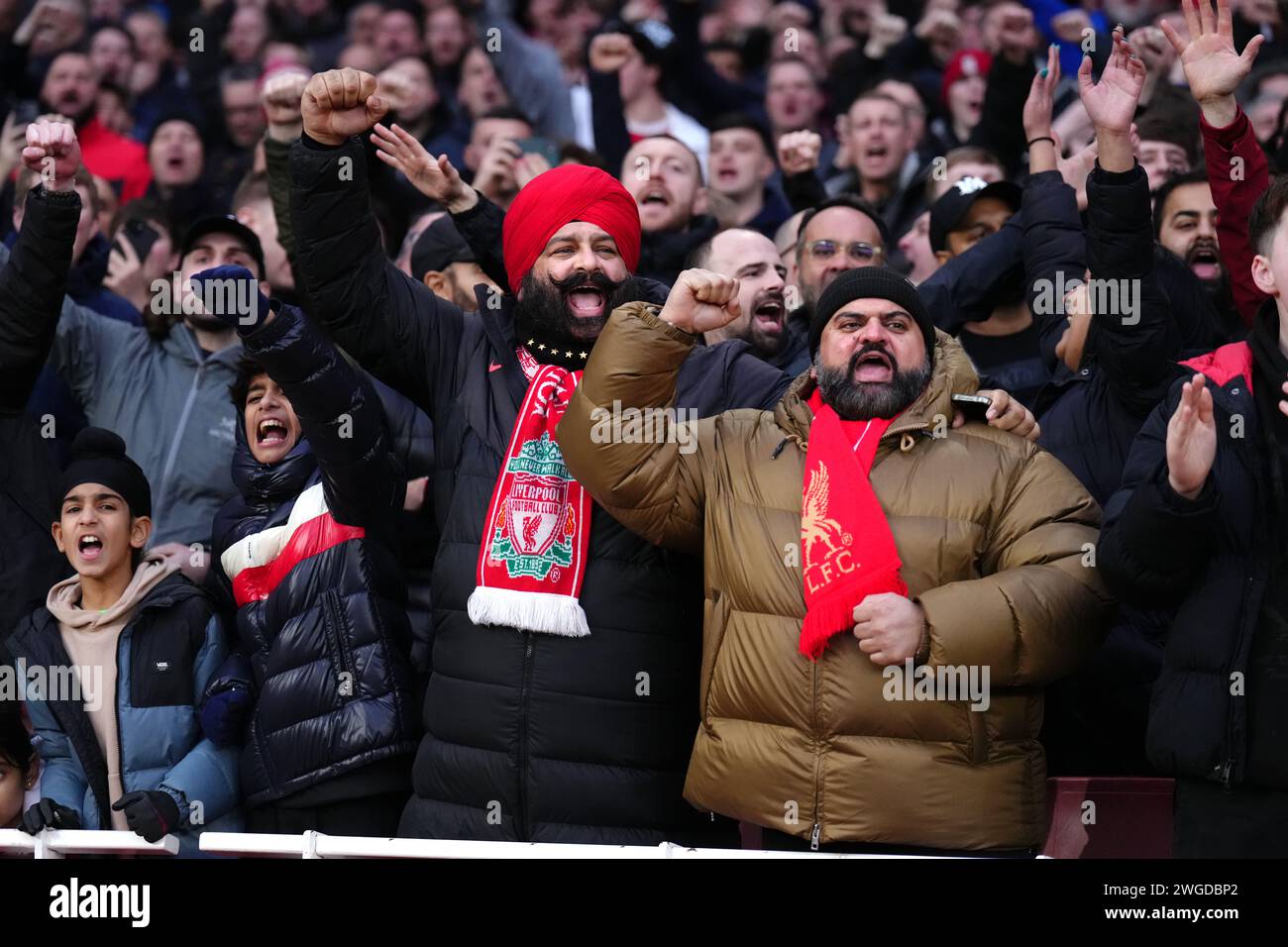 Liverpool fans cheer on their team ahead of the Premier League match at ...