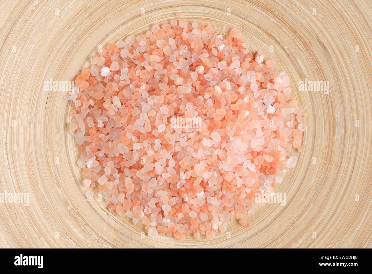 Pile of pink salt wooden background Stock Photo - Alamy