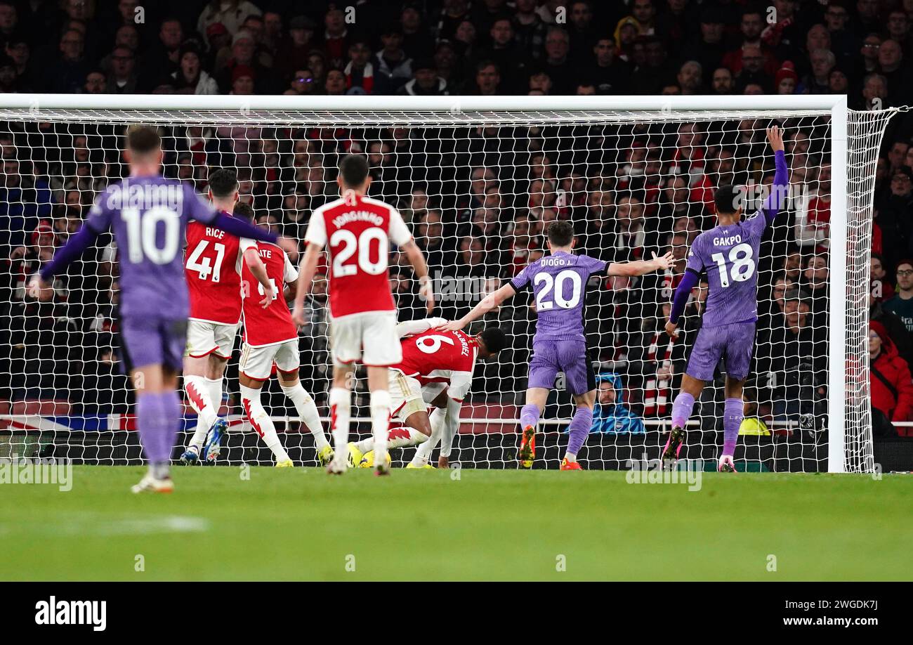 Arsenal's Gabriel (centre) scores Liverpool's first goal of the gamevia ...