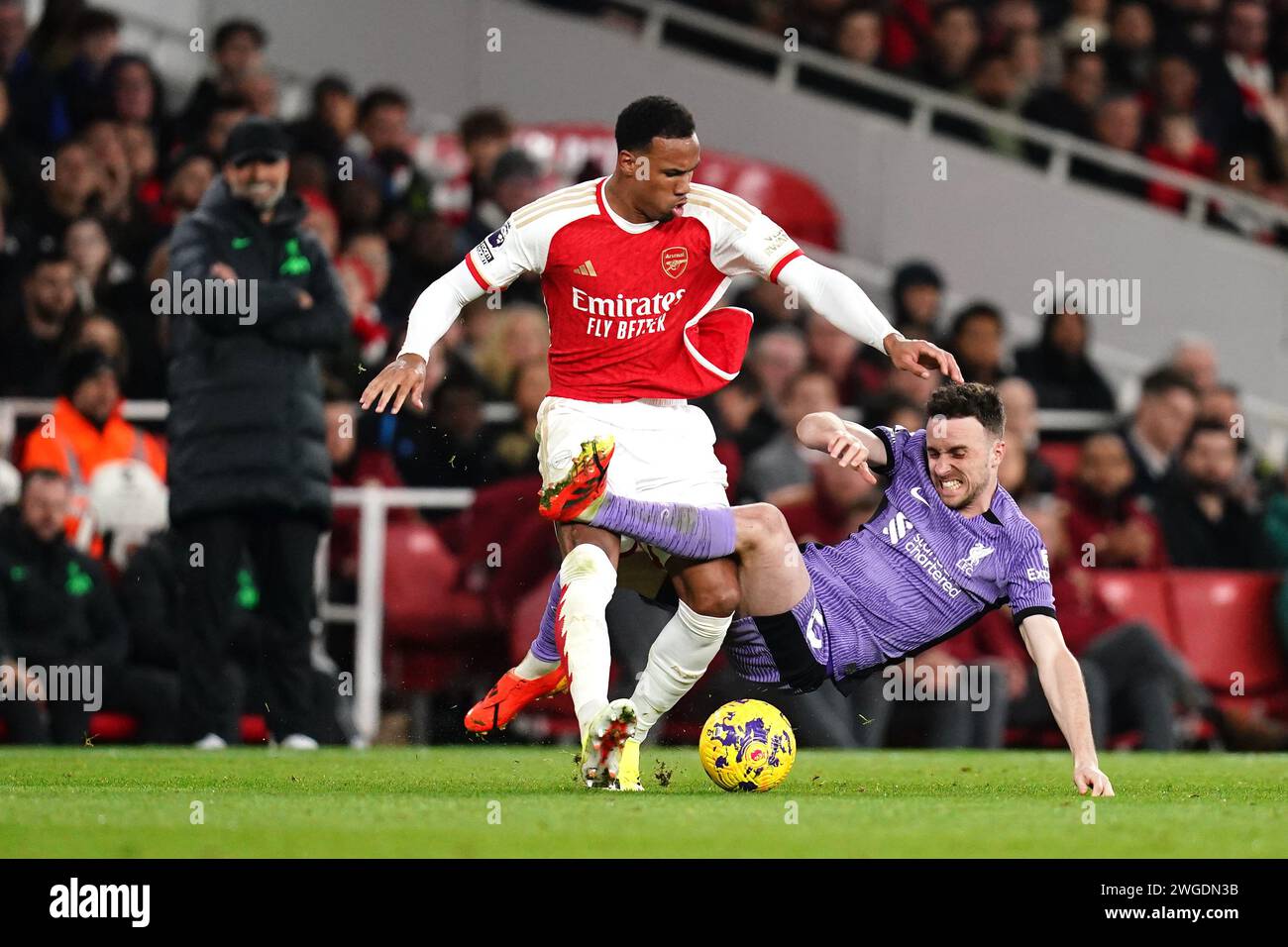 Liverpool's Diogo Jota (right) tackles Arsenal's Gabriel as Liverpool ...