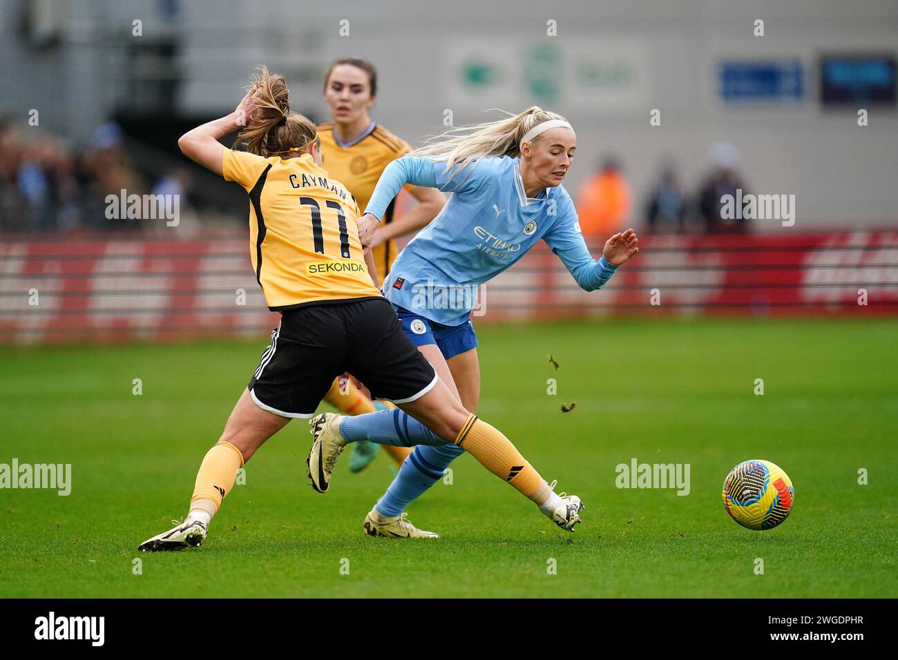 Manchester City's Chloe Kelly (right) goes past Leicester City's Janice ...