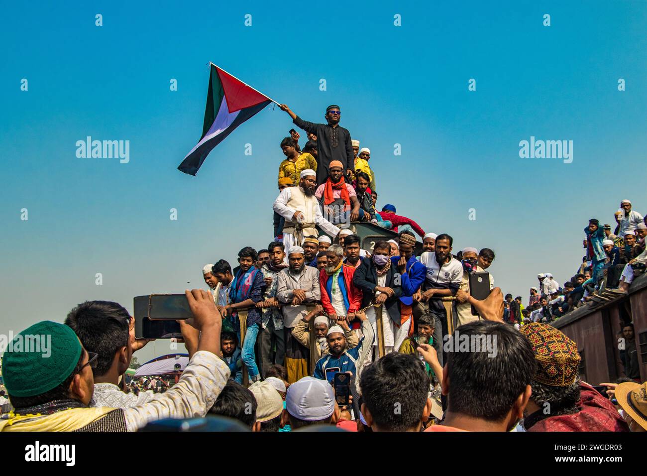 Embark on a brief but impactful ride atop the Ijtema train roof in ...