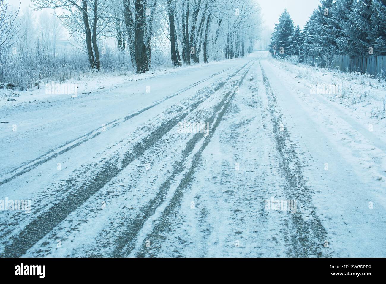 Country road during freezing january temperatures Stock Photo - Alamy