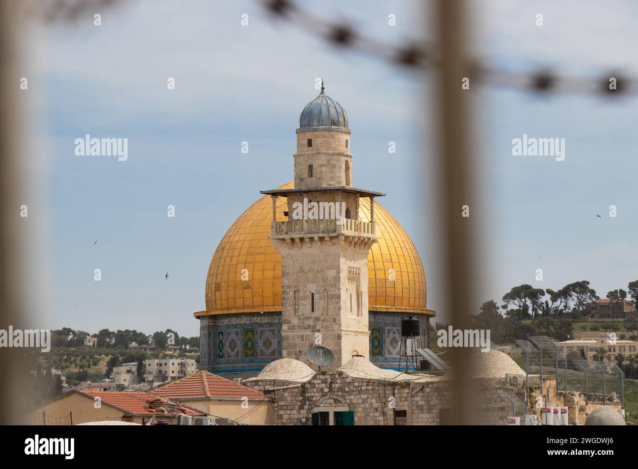 The Dome of the Rock and Bab al-Silsila Minaret, seen through barbed ...