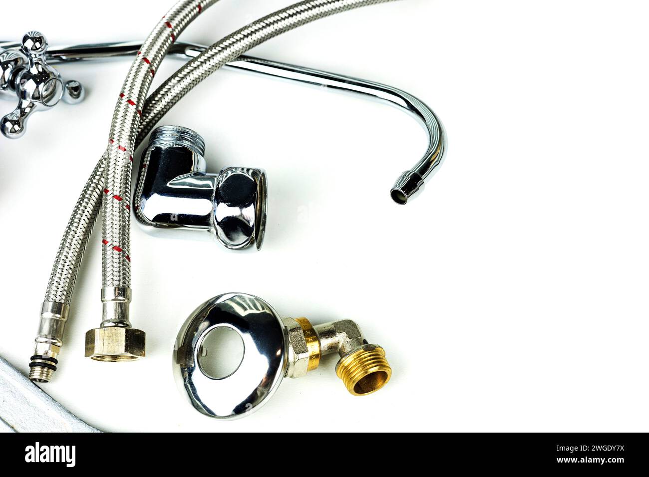 Plumbing parts, accessories and tools on a white background with copy ...