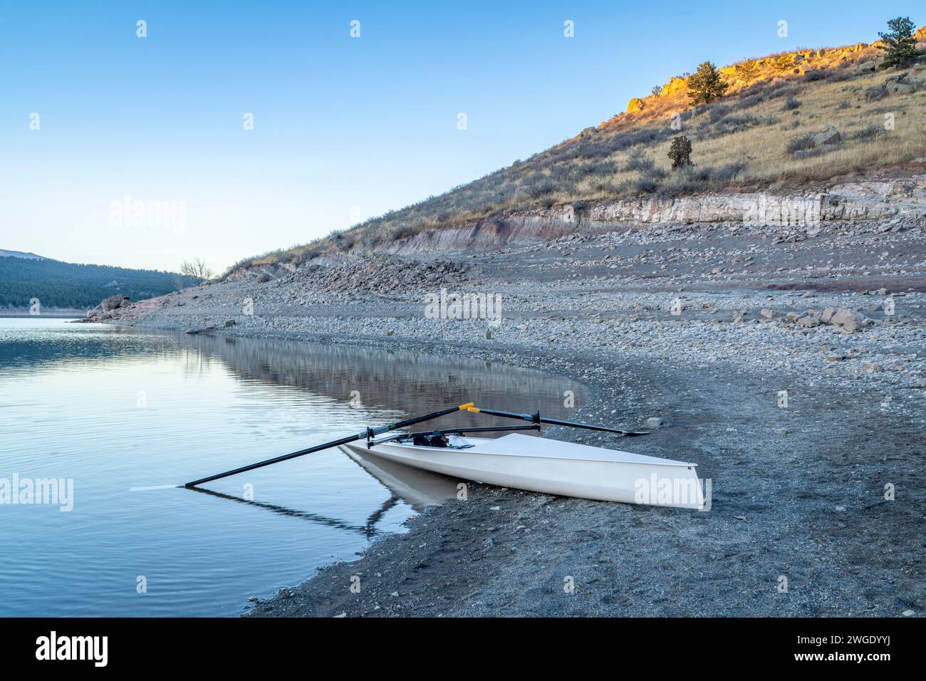 Coastal rowing shell on a shore of Carter Lake in northern Colorado at ...