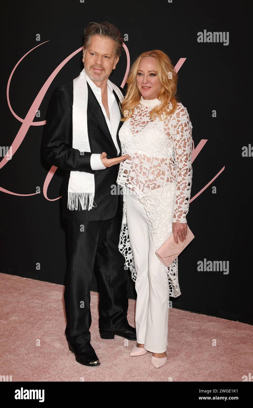 LOS ANGELES, CALIFORNIA - FEBRUARY 03: (L-R) Nick Holmes and Virginia Madsen arrive at the ...