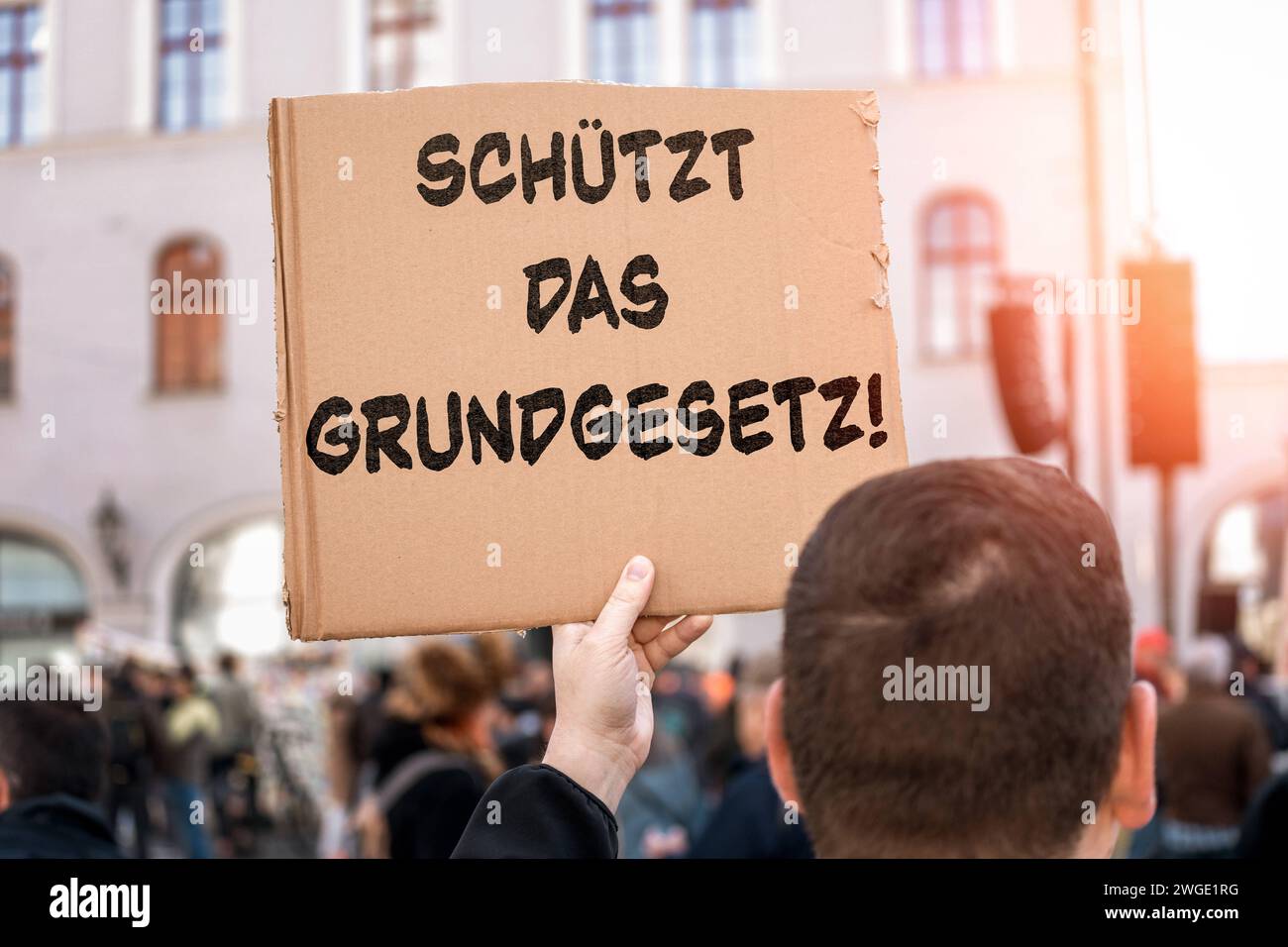 4 February 2024: Protect the Basic Law Lettering on a sign held by a ...