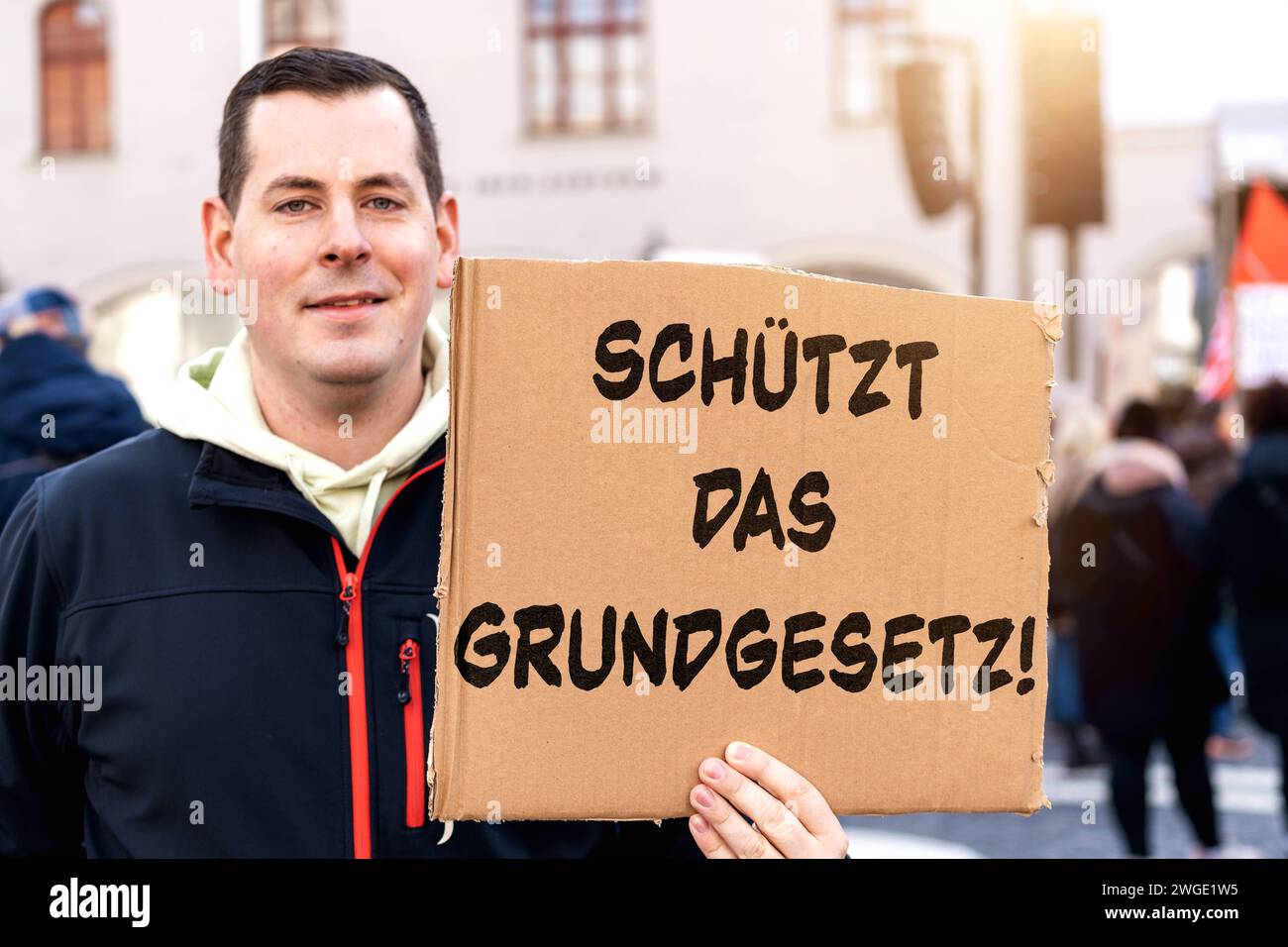 4 February 2024: Protect the Basic Law Lettering on a sign held by a ...