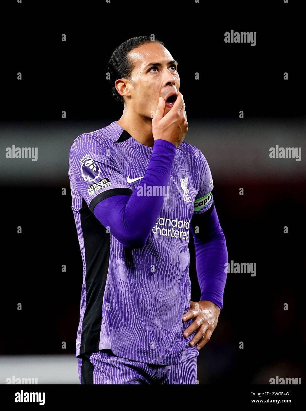 Liverpool's Virgil van Dijk stands dejected at the end of the match ...