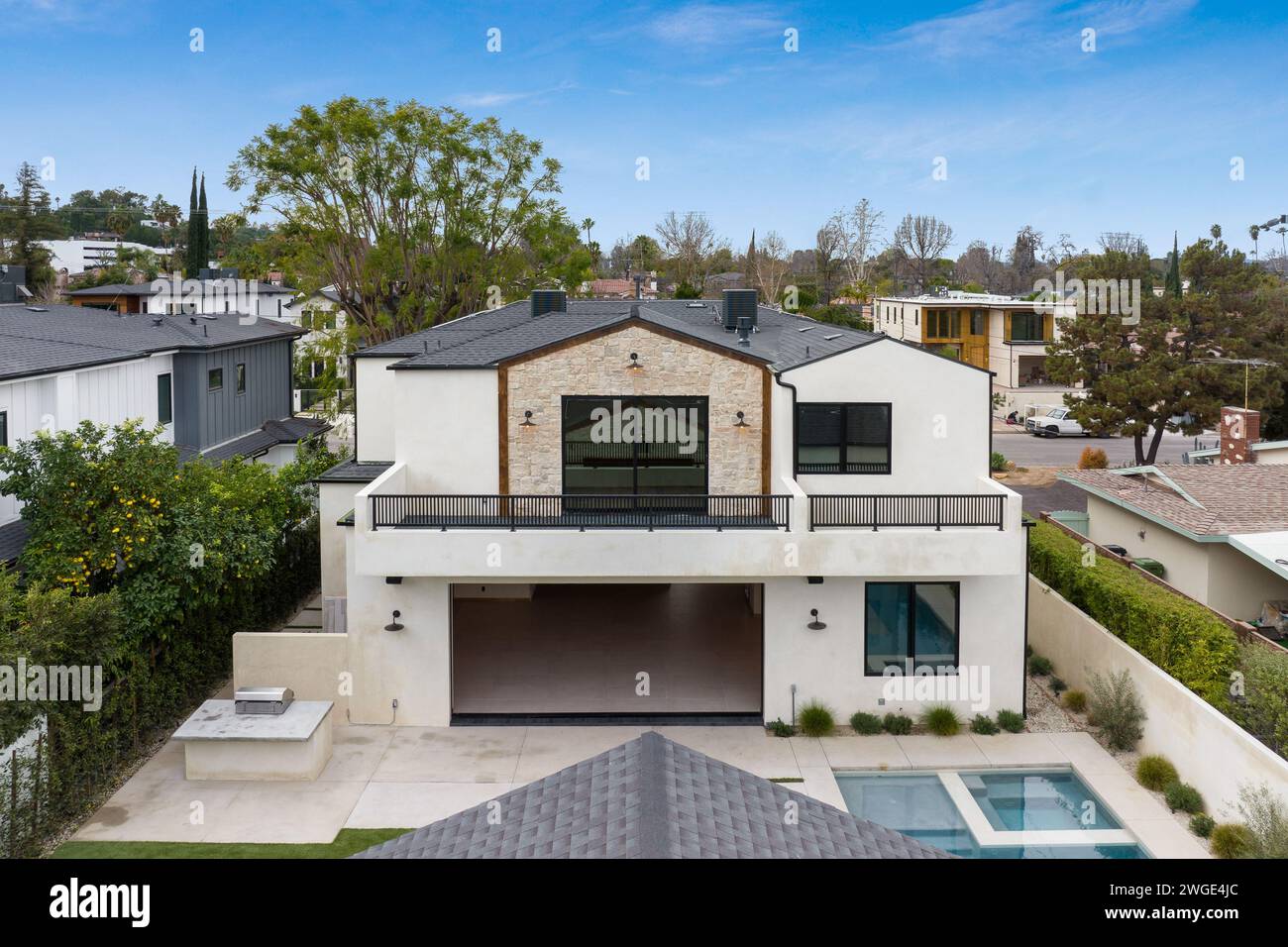 An aerial view of a house featuring a pool and an outdoor terrace Stock ...