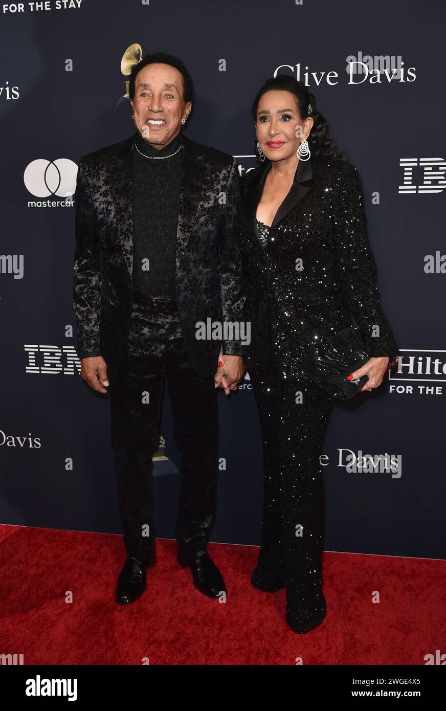 Smokey Robinson, left, and Frances Gladney arrive at the Pre-Grammy ...