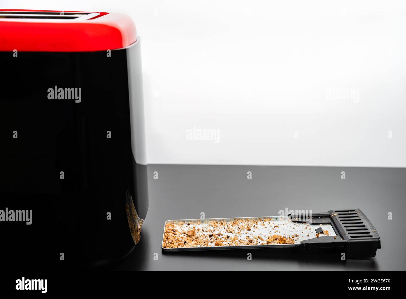 A tray full of bread crumbs from a toaster Stock Photo - Alamy