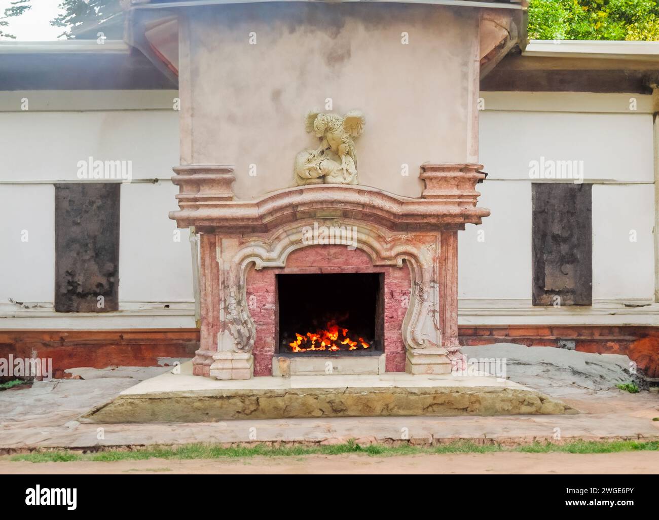 front view, medium distance of a pink marble,fireplace against an ...