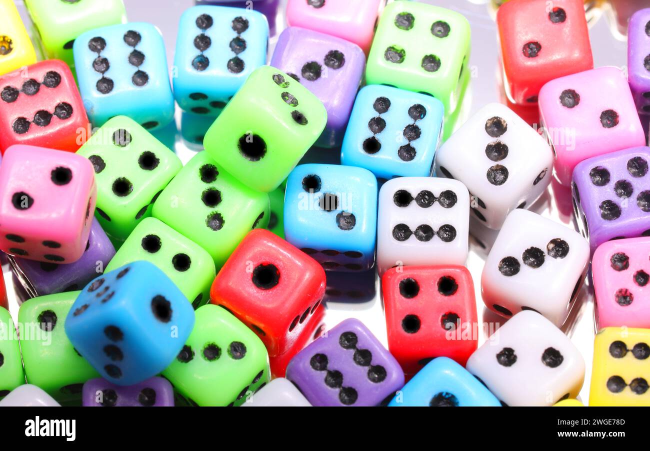 background of many mini cubic six-sided gaming dice rolled for playing ...