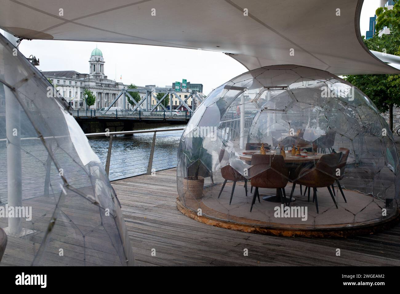 Restaurant tables in domes in Boardwalk Lapps Quay, Cork Stock Photo ...