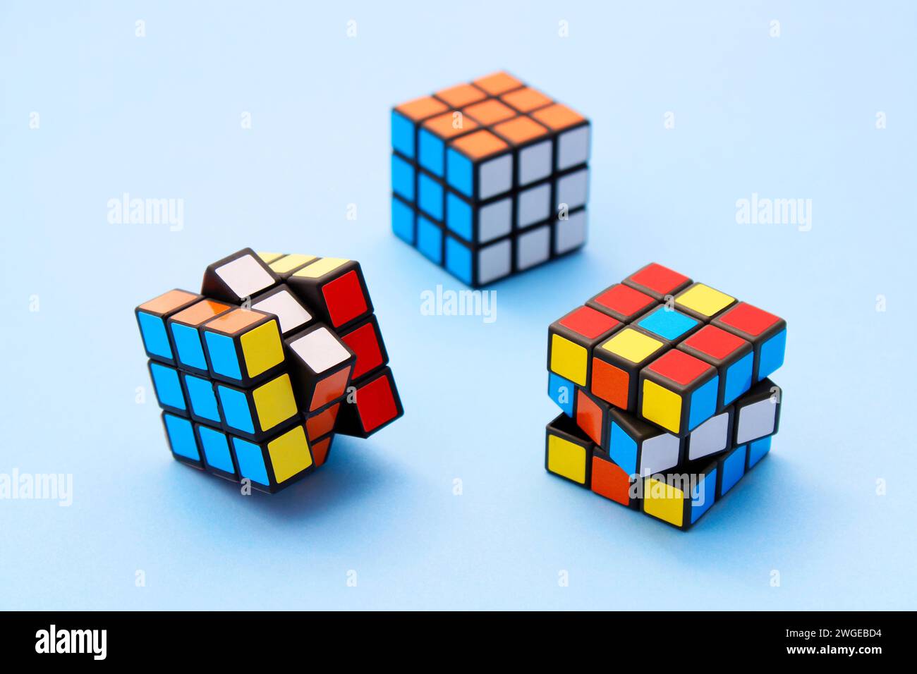 Three colorful Rubik's cubes searching game solution Stock Photo - Alamy
