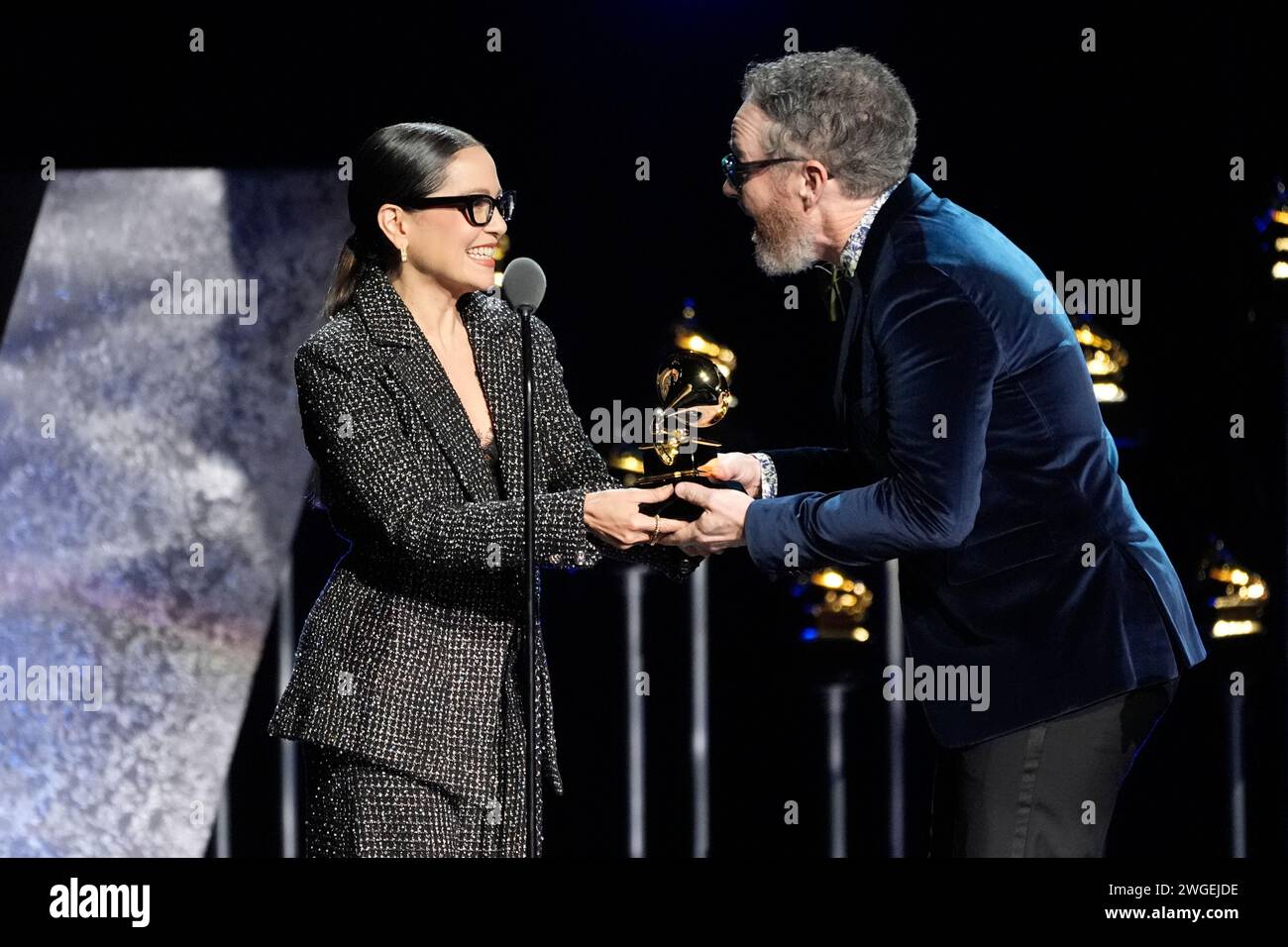 Natalia Lafourcade, left, presents Gordy Haab with the award for best ...