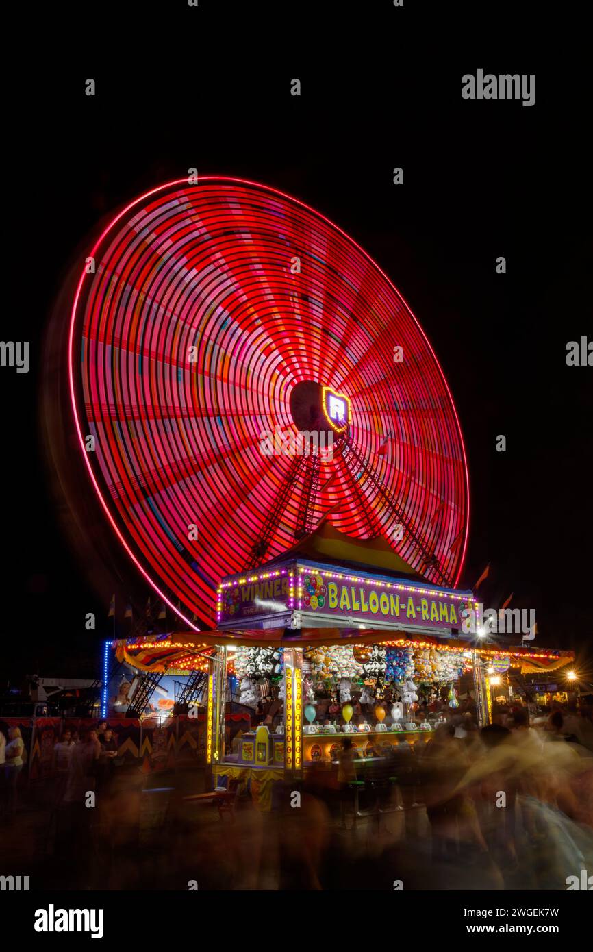Dutch Wheel. Ferris Wheel. Carnival Ride with long exposure motion blur ...
