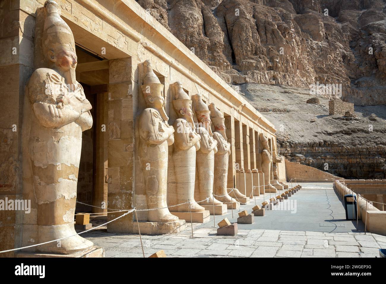 View of a row statues of Pharaoh Hatshepsut statue in the Temple of ...