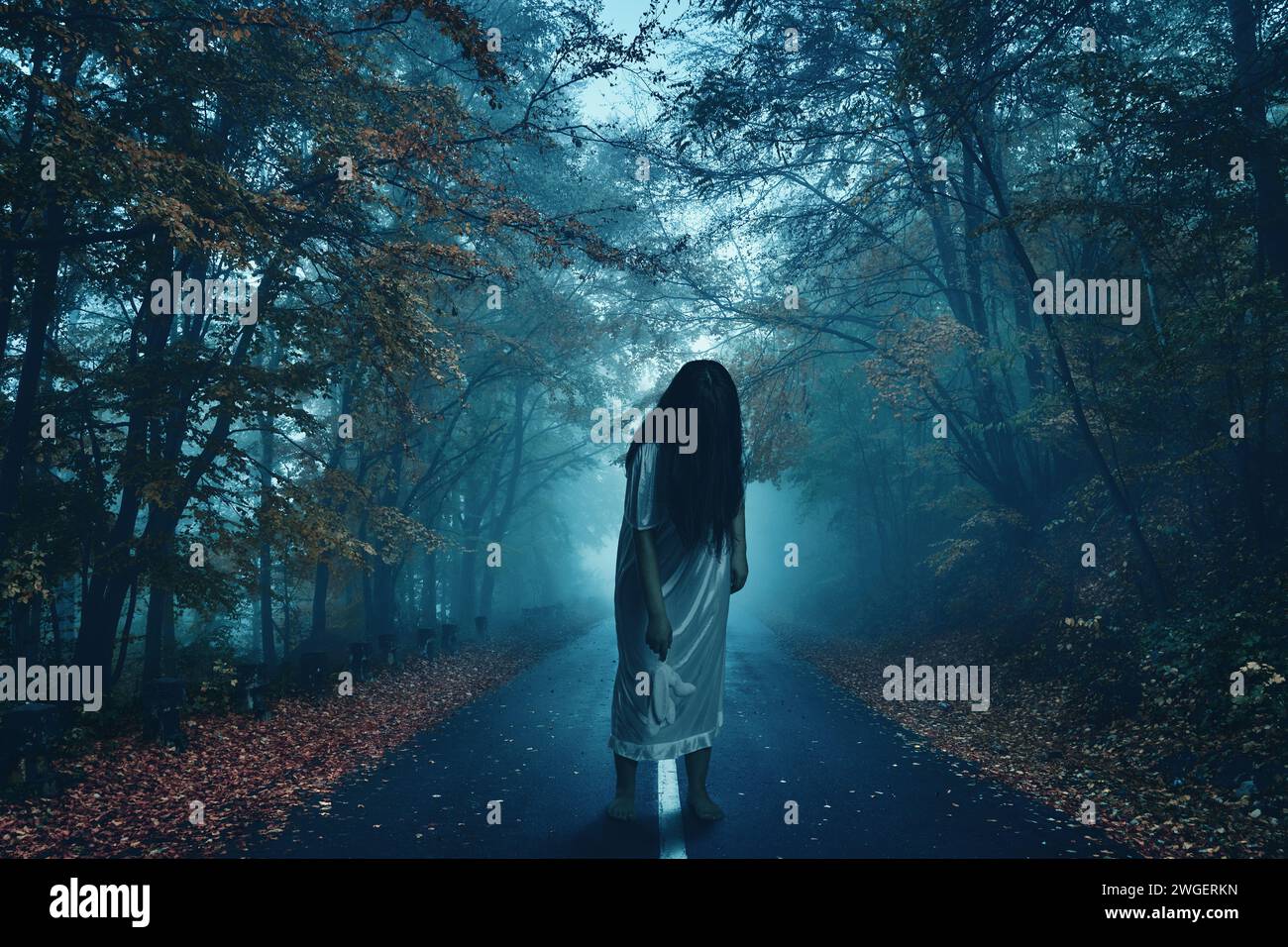 Zombie girl in night gown holding a soft rabbit toy walking barefoot in ...