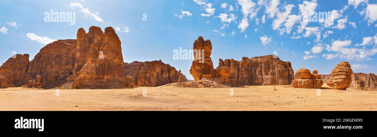 Rocky desert formations with sand in foreground, typical landscape of ...