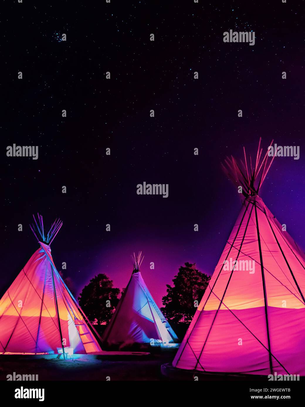 Three vaporwave-style teepees glowing at night under stars in Marfa ...