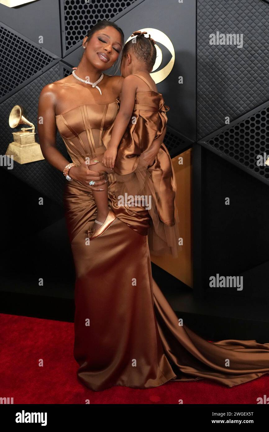 Victoria Monet, left, and Hazel Monet Gaines arrive at the 66th annual ...