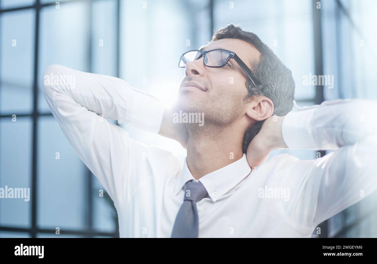 relaxed Caucasian young male rest in chair distracted from computer ...
