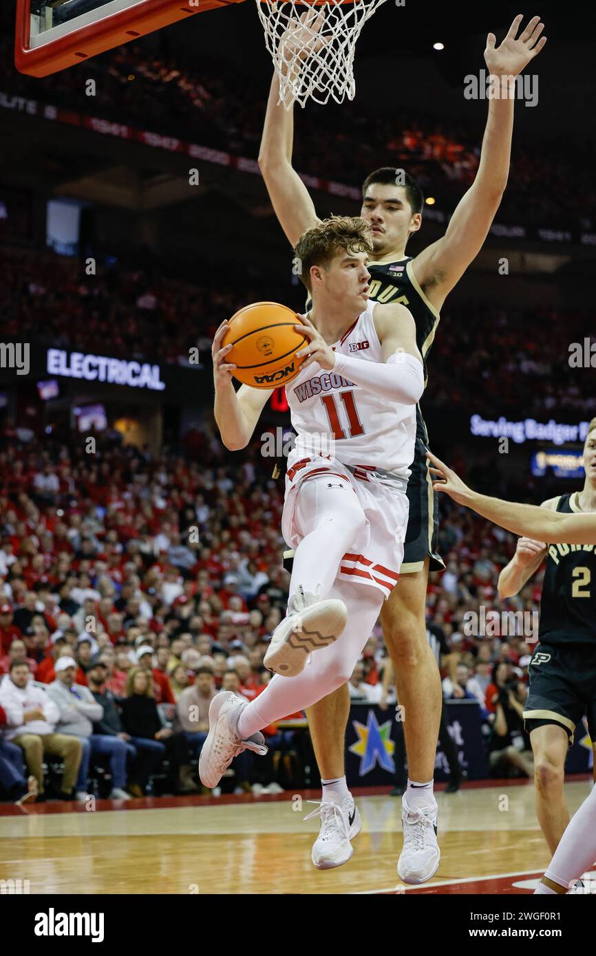 Madison, WI, USA. 4th Feb, 2024. Wisconsin Badgers guard Max Klesmit (11) looks to pass the ball ...