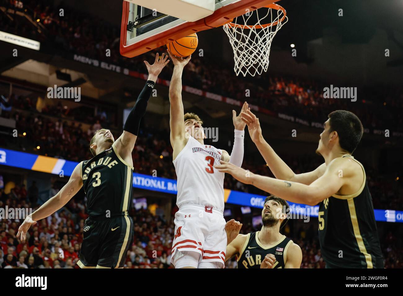 Madison, WI, USA. 4th Feb, 2024. Wisconsin Badgers guard Connor Essegian (3) makes a layup in ...