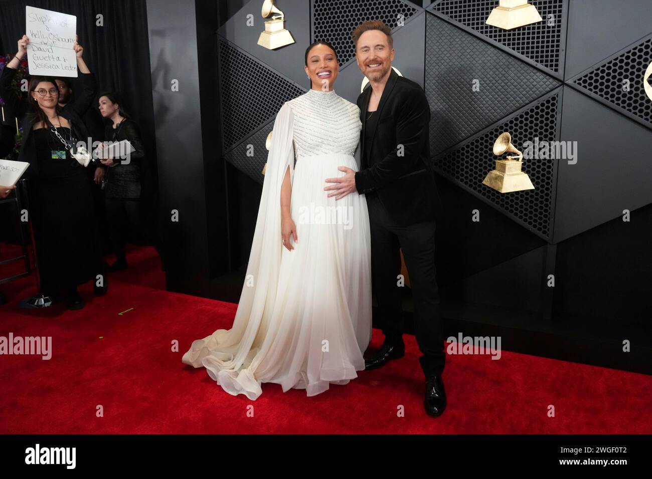 Jessica Ledon, left, and David Guetta arrive at the 66th annual Grammy ...