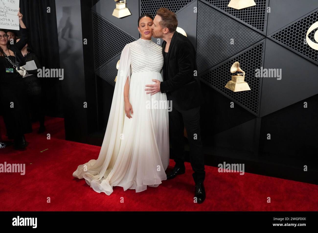 Jessica Ledon, left, and David Guetta arrive at the 66th annual Grammy ...
