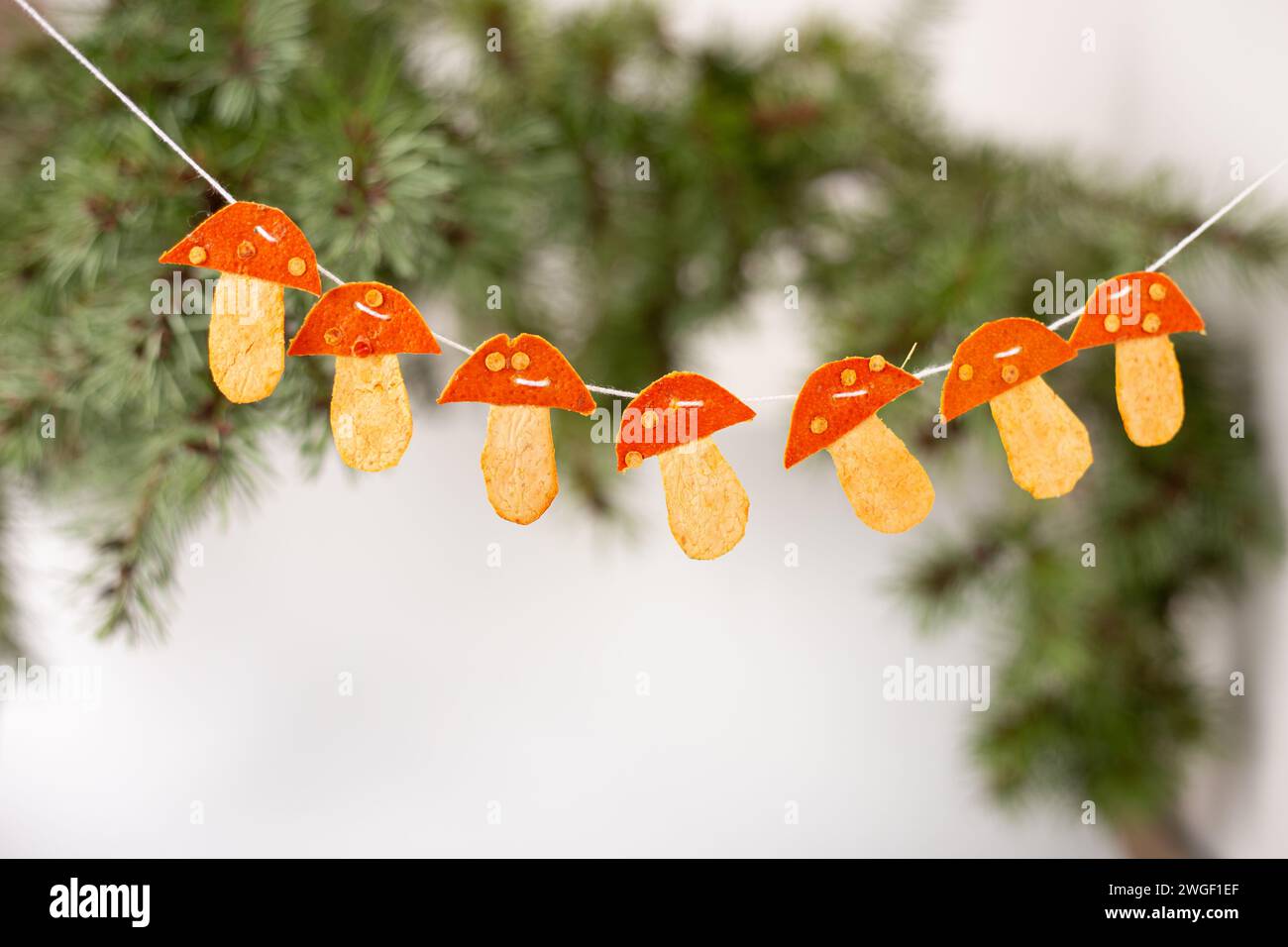 mushroom garland made of dry tangerine peel, DIY, craft for kids Stock ...