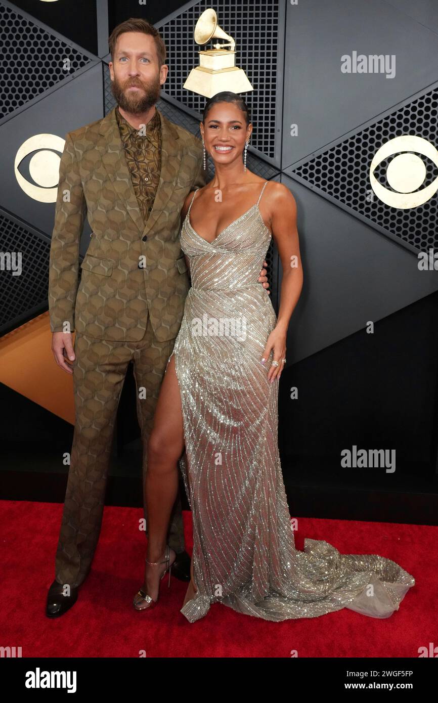 Calvin Harris, left, and Vick Hope arrive at the 66th annual Grammy ...