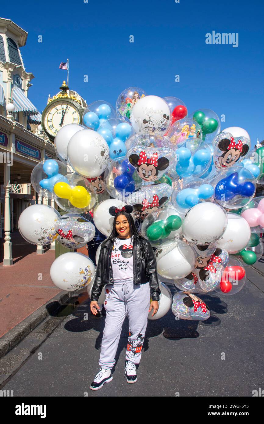 Young woman with Disney balloons, Main Street, U.S.A, Magic Kingdom ...