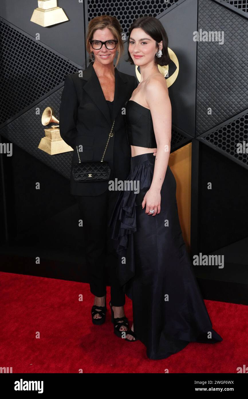 Katie McGrath, left, and Gracie Abrams arrive at the 66th annual Grammy ...